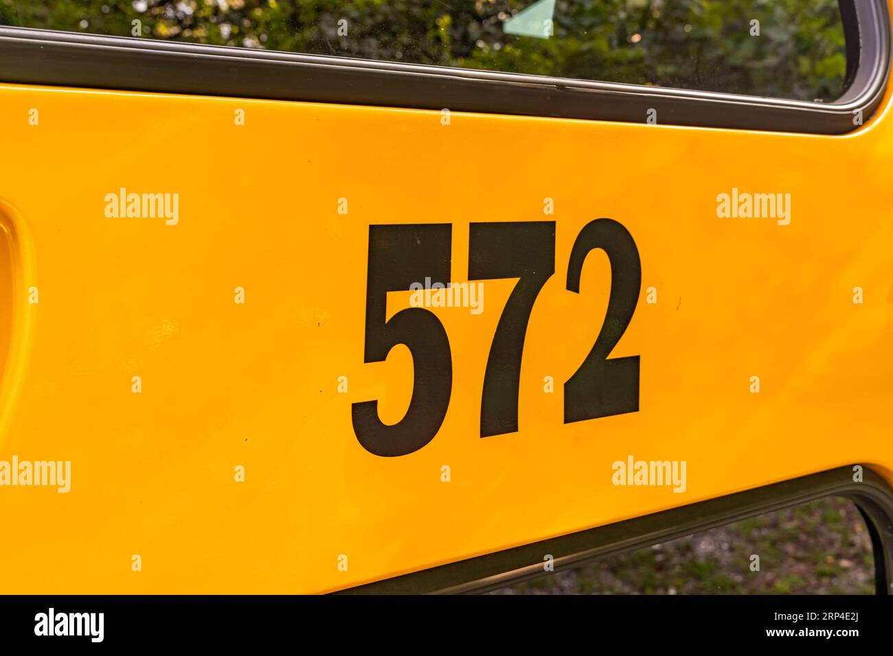 Back of a parked yellow school bus number 572 Stock Photo - Alamy