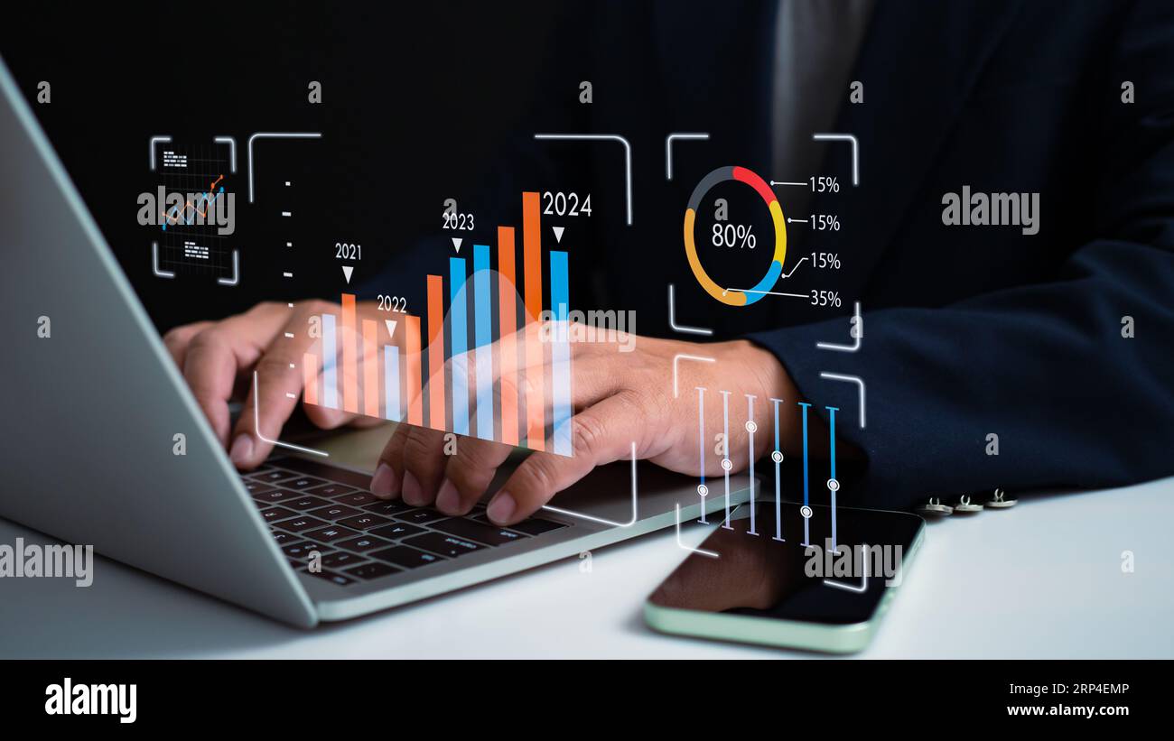 Business people use computers to analyze business and manage corporate ...