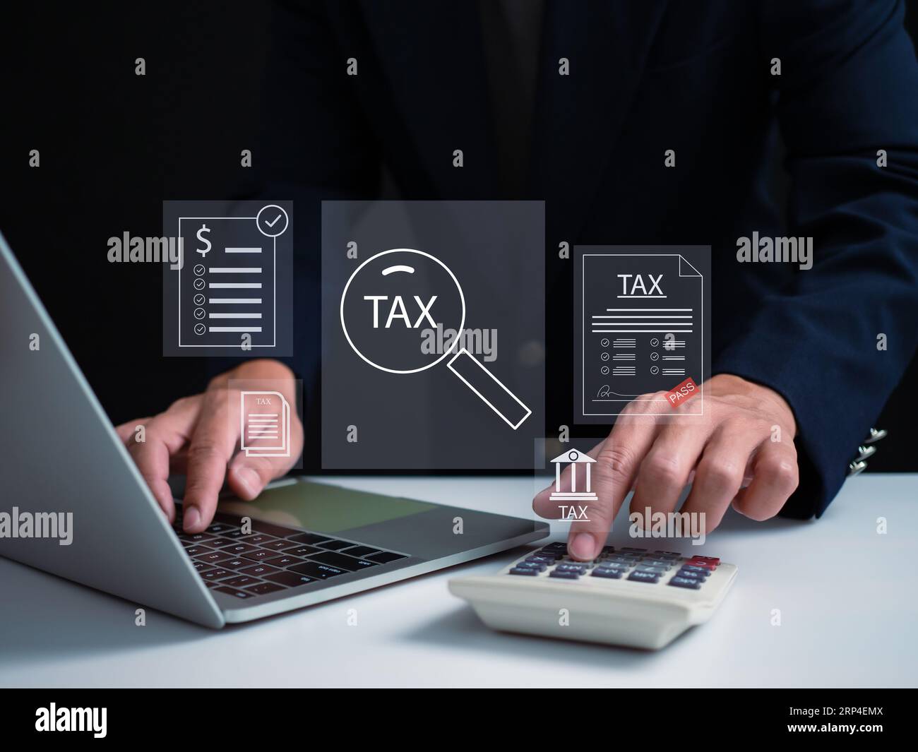 Businessman using a computer to complete Individual income tax return ...