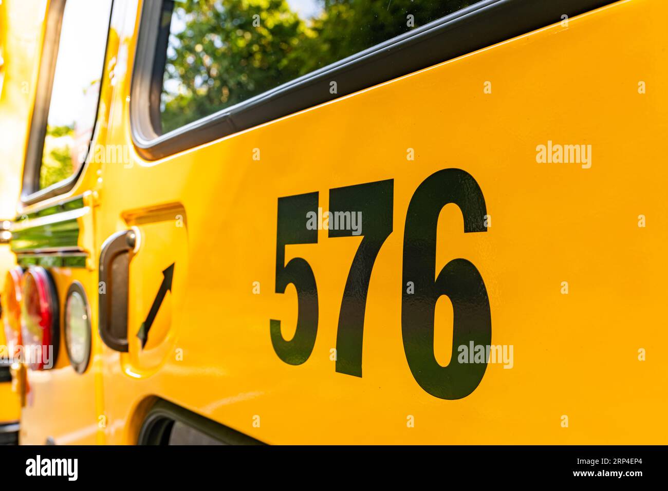 rear of a parked yellow school bus number 676 Stock Photo - Alamy