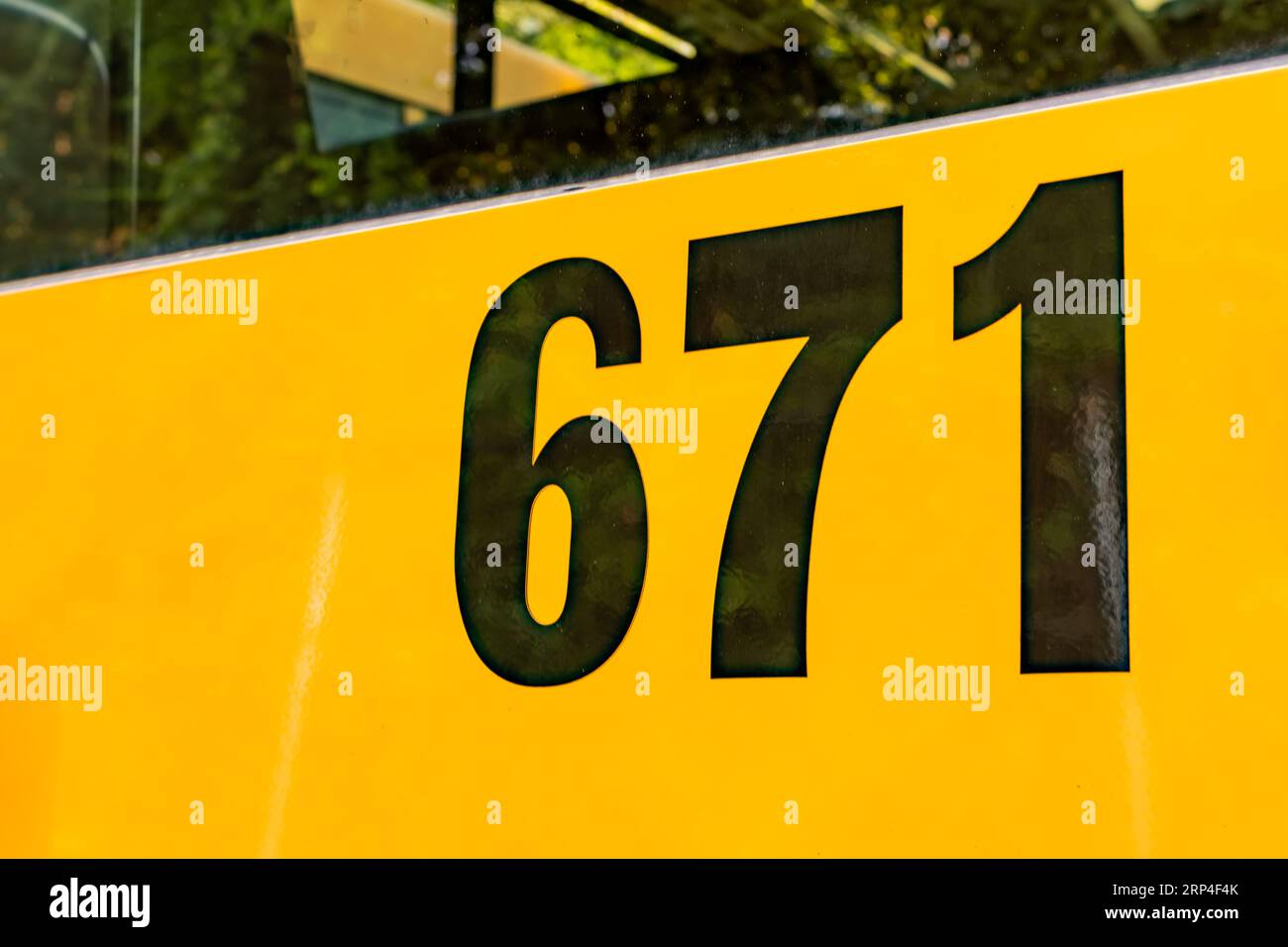 Rear of a parked yellow school bus number 671 Stock Photo - Alamy