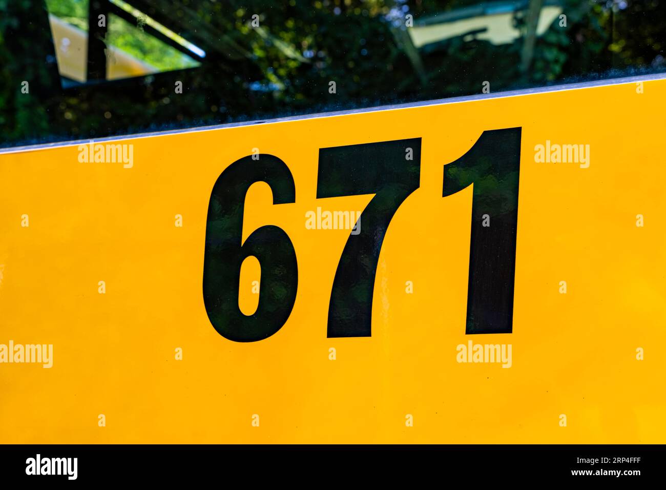 Rear of a parked yellow school bus number 671 Stock Photo - Alamy