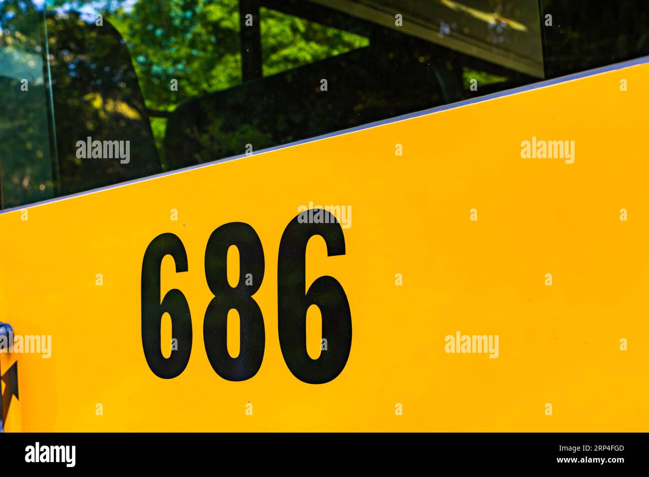 Rear of a parked yellow school bus number 686 Stock Photo - Alamy