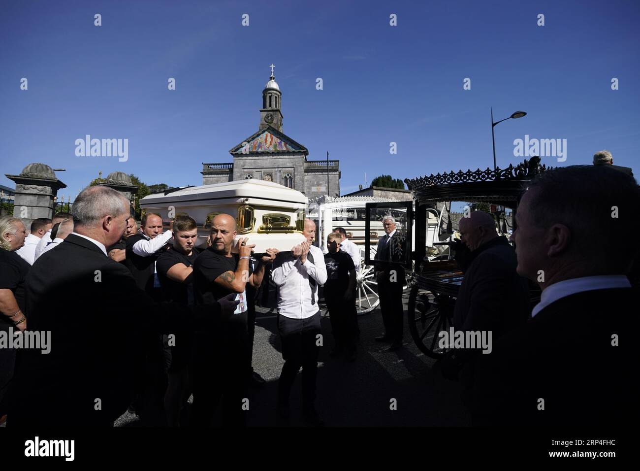 The coffins of Thomas Reilly, 45, his wife Bridget Reilly, 46, and ...