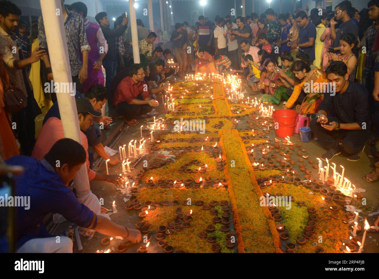 Hindu devotees light oil lamps hi-res stock photography and images - Alamy