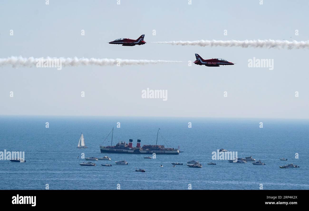 The RAF Red Arrows display team perform over the sea at the Bournemouth ...