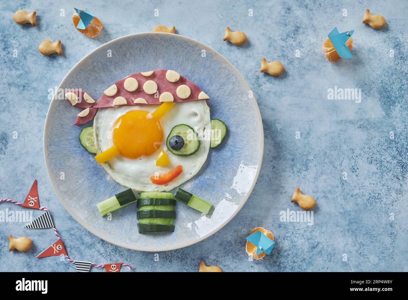 Funny pirate fried egg with ham and vegetable for kid breakfast Stock ...