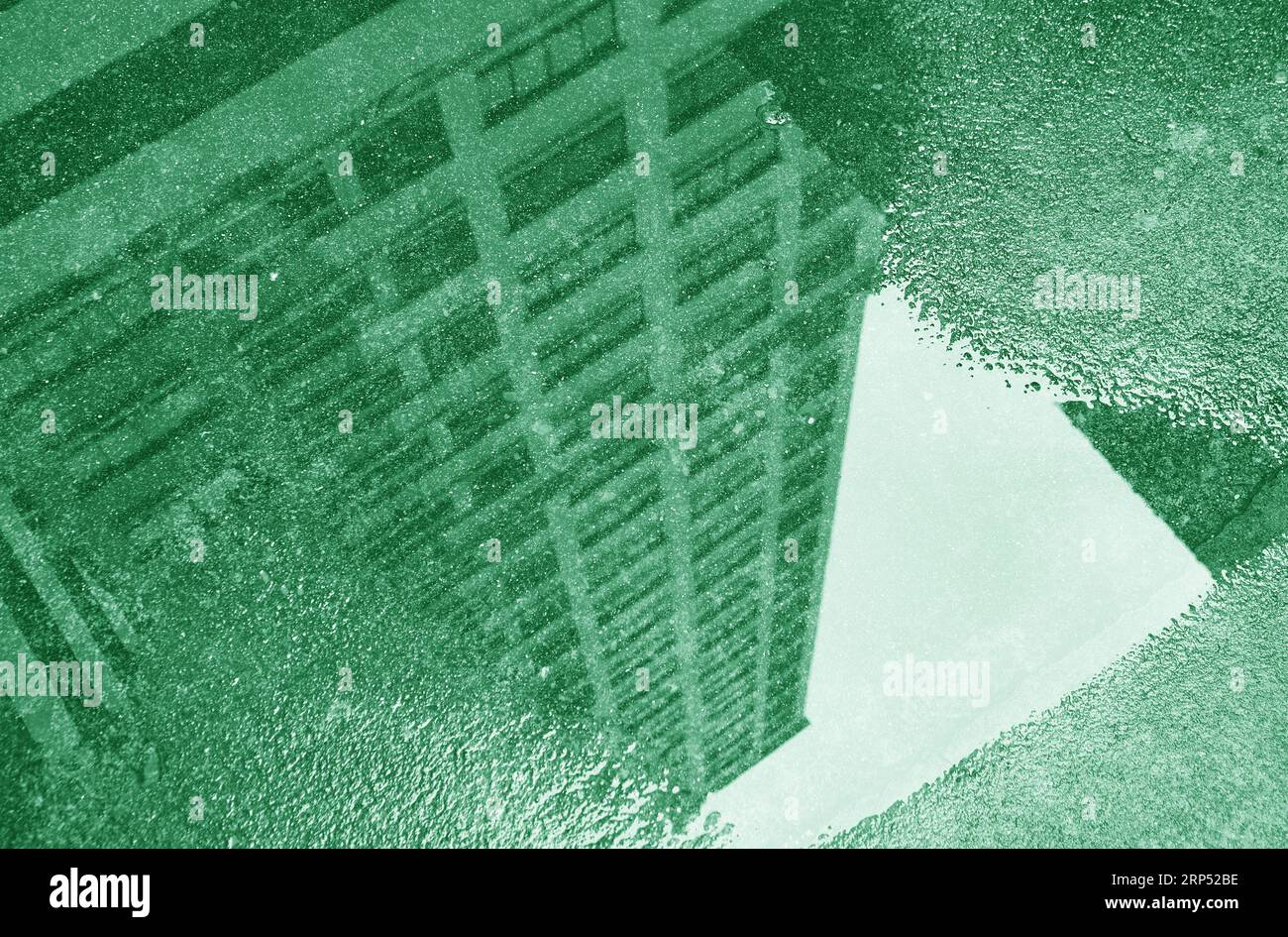 Surreal pop art of high buildings reflecting on the puddle in green ...