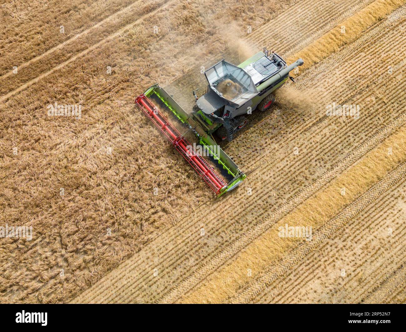 Aerial view of a combine harvester working on farmland in North ...