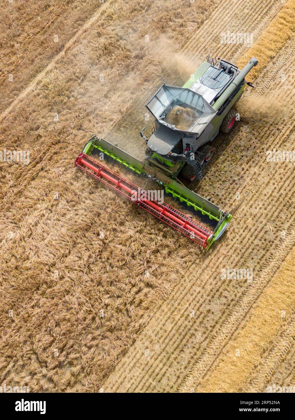 Aerial view of a combine harvester working on farmland in North ...