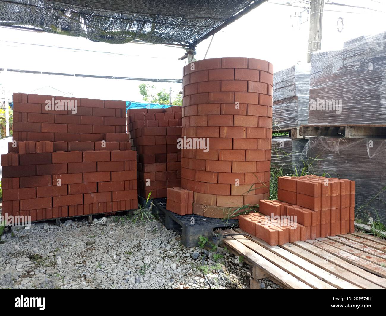 Brown interlocking brick blocks, stacked together, commonly used for ...