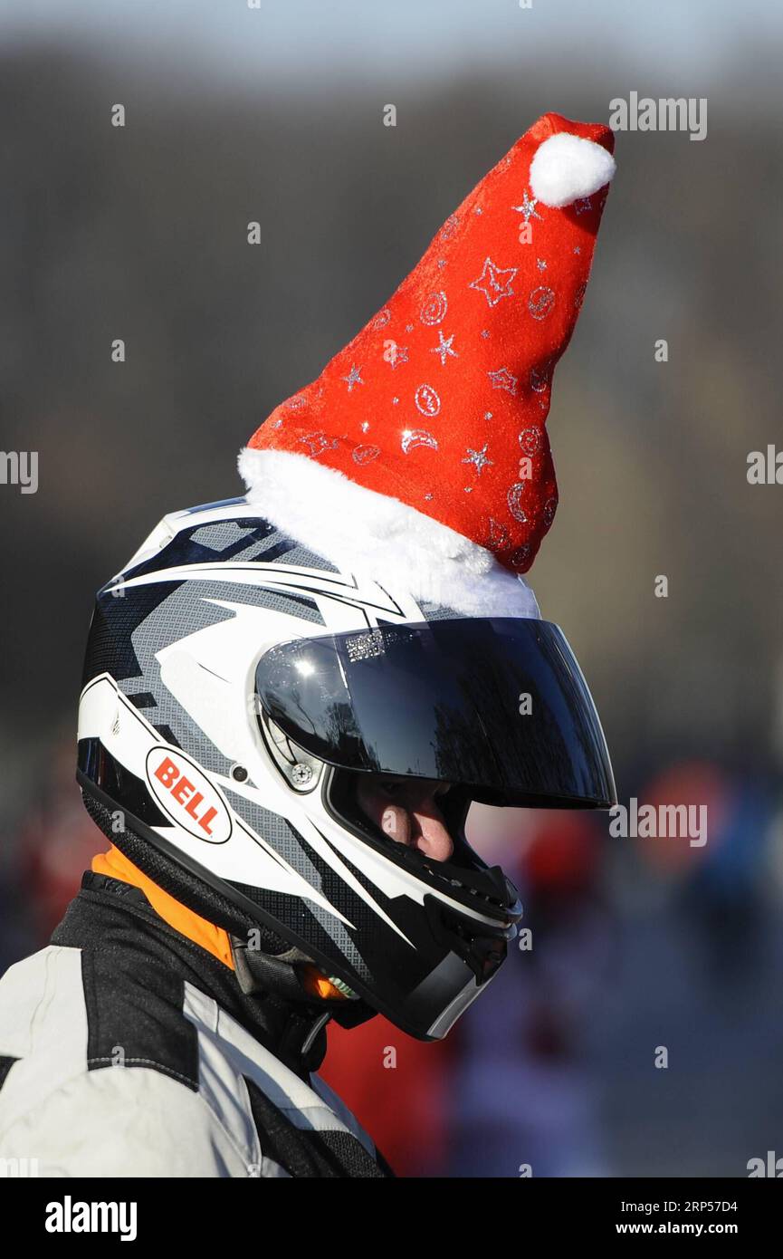 (181201) -- WARSAW, Dec. 1, 2018 -- A motorcyclist wearing a Santa ...