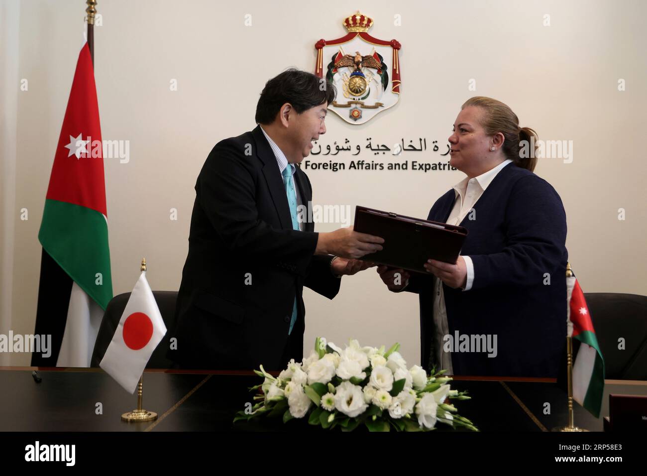 Japan's Foreign Minister Yoshimasa Hayashi, left, and Jordan's Minister of Planning Zeina Toukan ...
