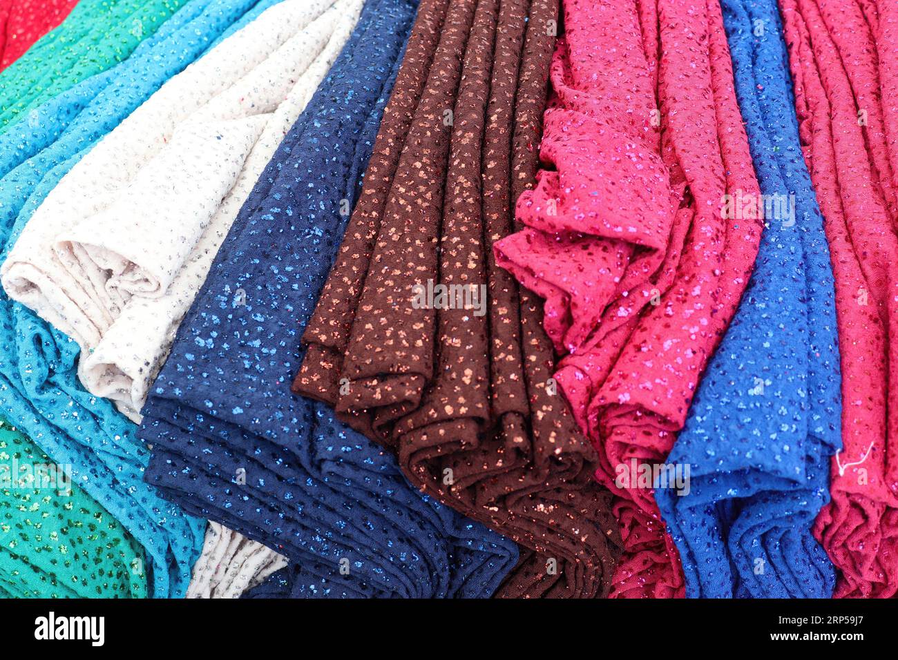 Close up view on samples of cloth and fabrics in different colors Stock ...