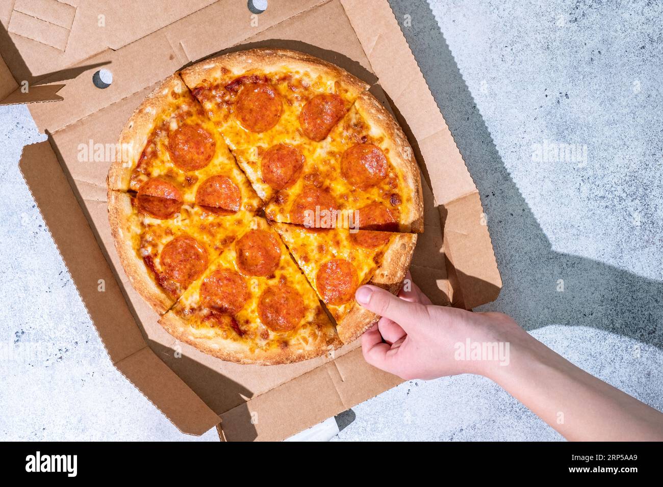 Grabbing slices hi-res stock photography and images - Alamy