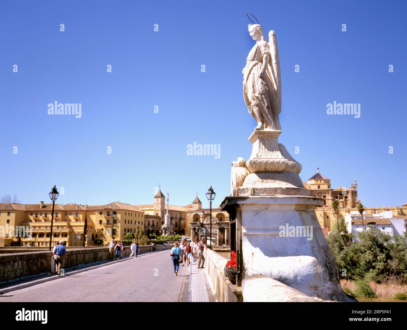 Archangel raphael statue on the Roman bridge at Cordoba Spain. The ...