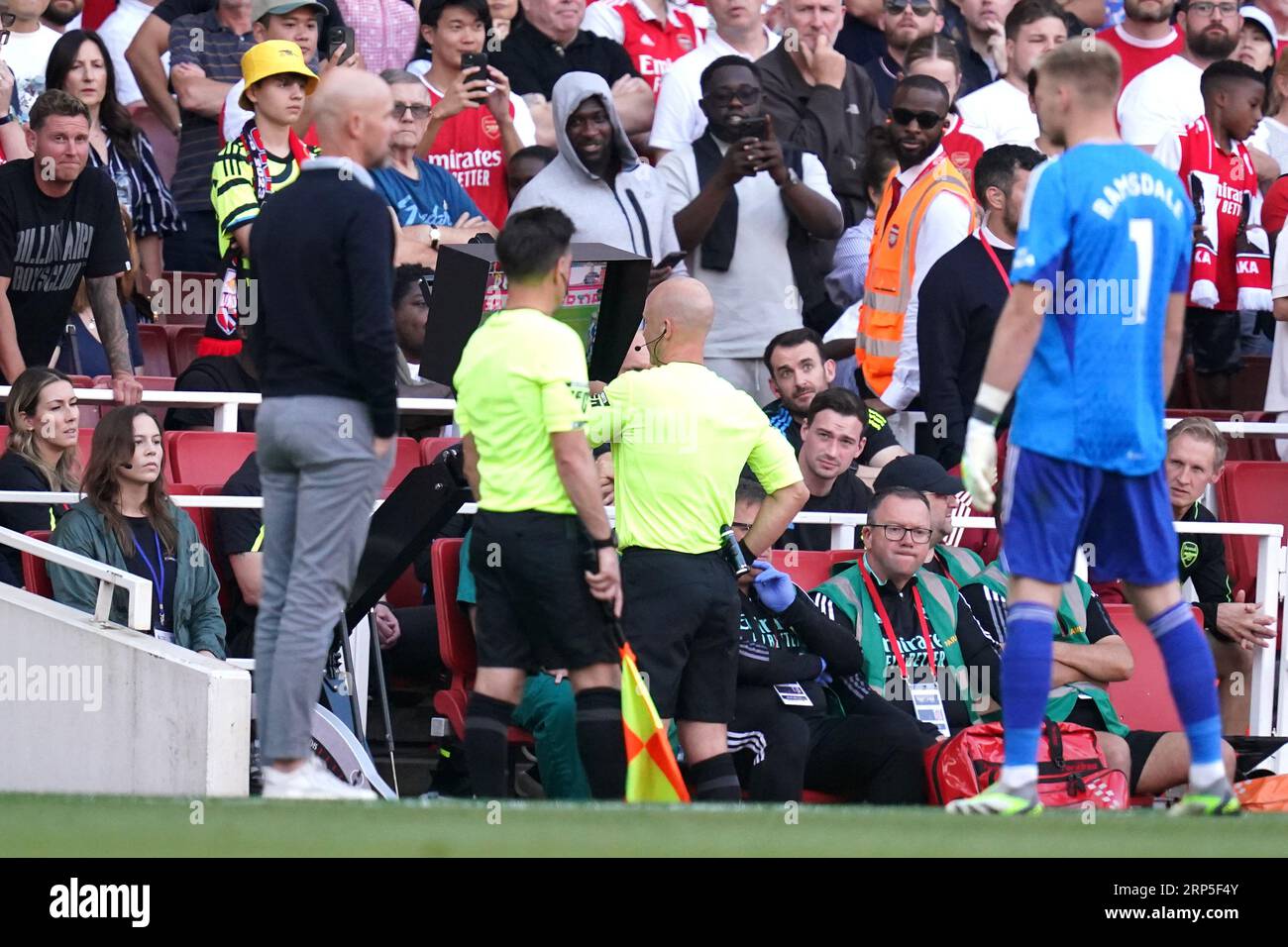 Referee Anthony Taylor reviews the on pitchside VAR before overturning ...