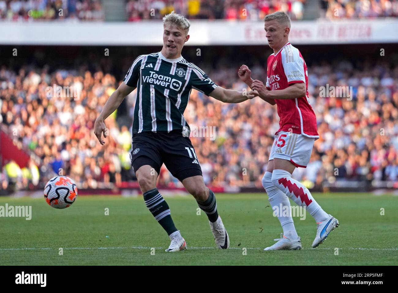 Manchester United's Rasmus Winther Hojlund, left, Arsenal's Oleksandr ...
