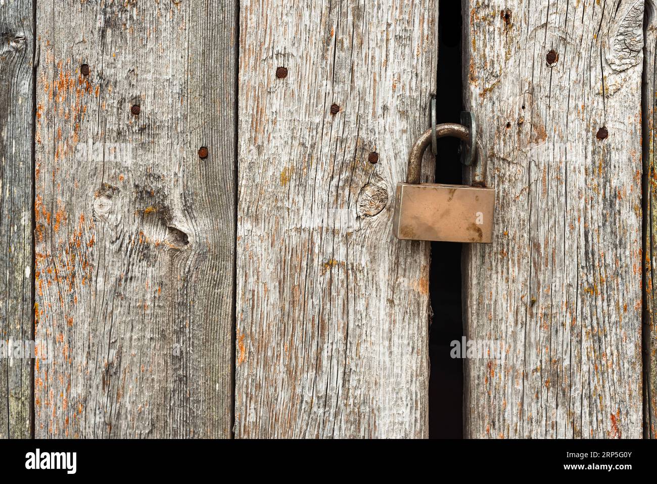 Old rusty lock on metal doors. Lock on the door with an empty place for ...