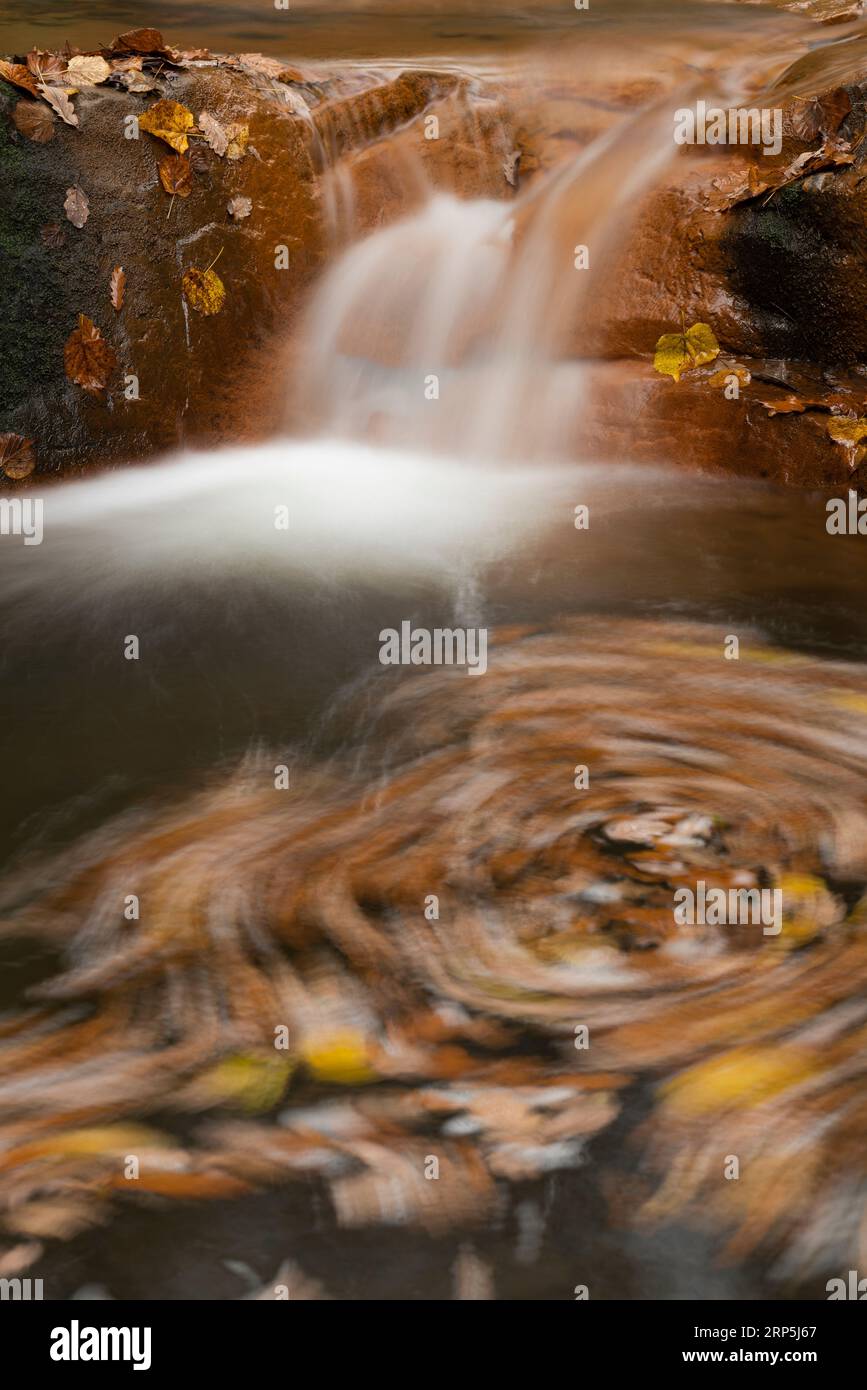 A waterfall near Coalbrookdale, Ironbridge in Autumn with eddy pools ...