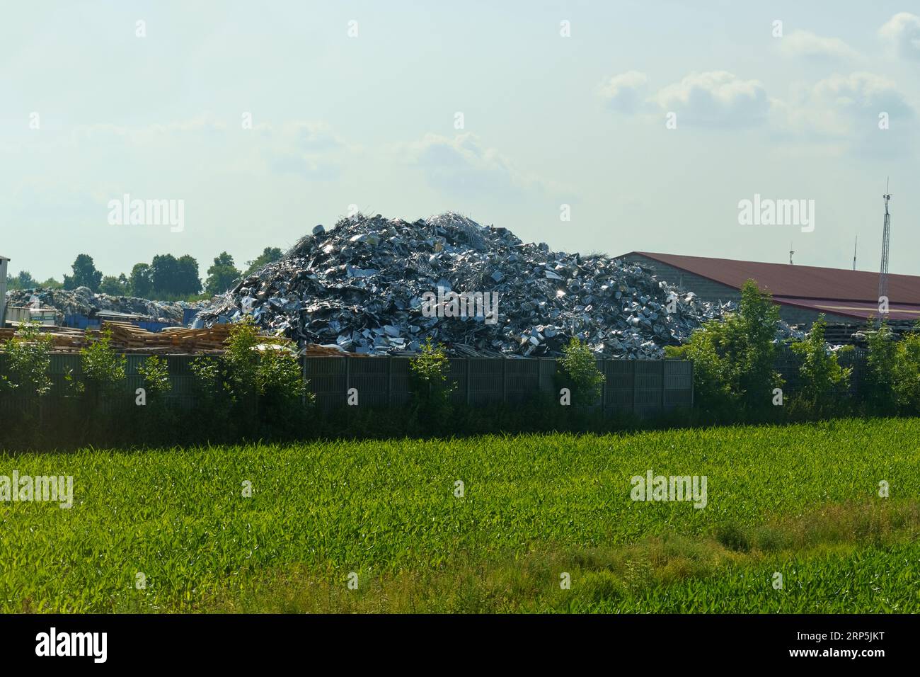Recycling warehouse. A mountain of metal waste from production ...