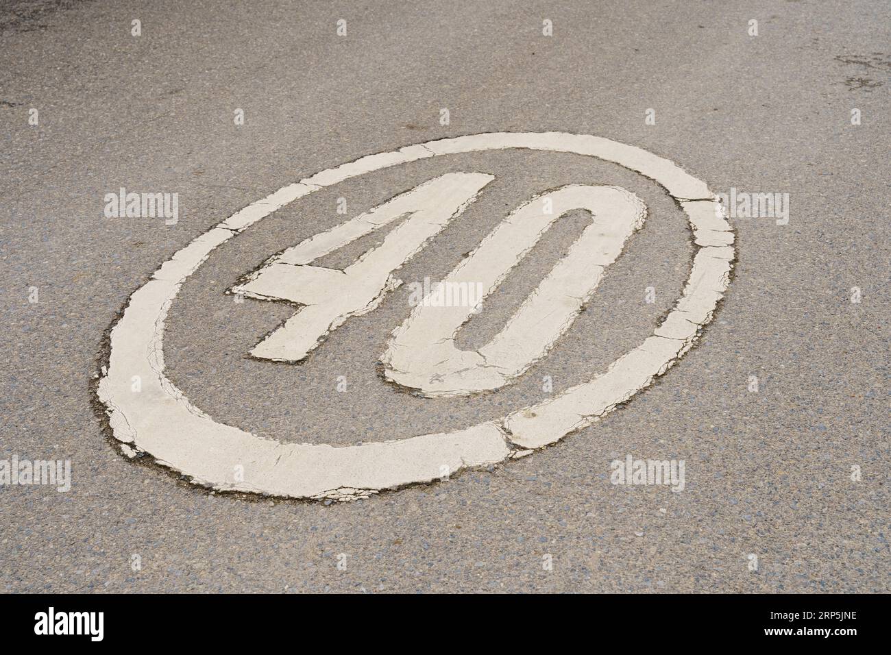 The speed limit sign is painted on the road with white paint. Close-up ...