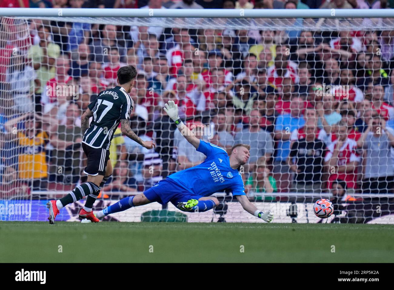 Manchester United's Alejandro Garnacho, left, scores a goal before it ...