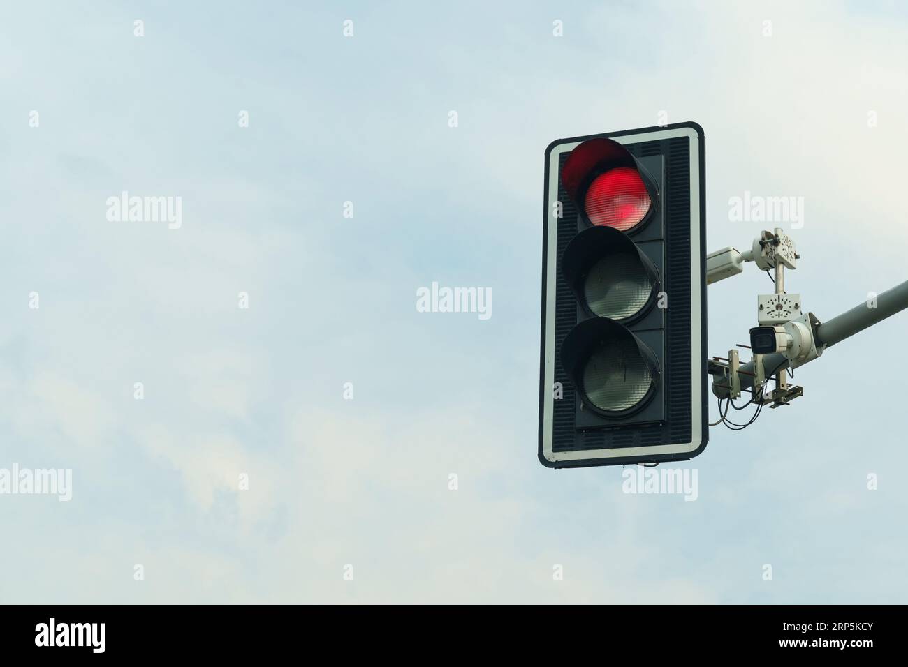 View of a traffic light and a traffic camera that captures the passage ...