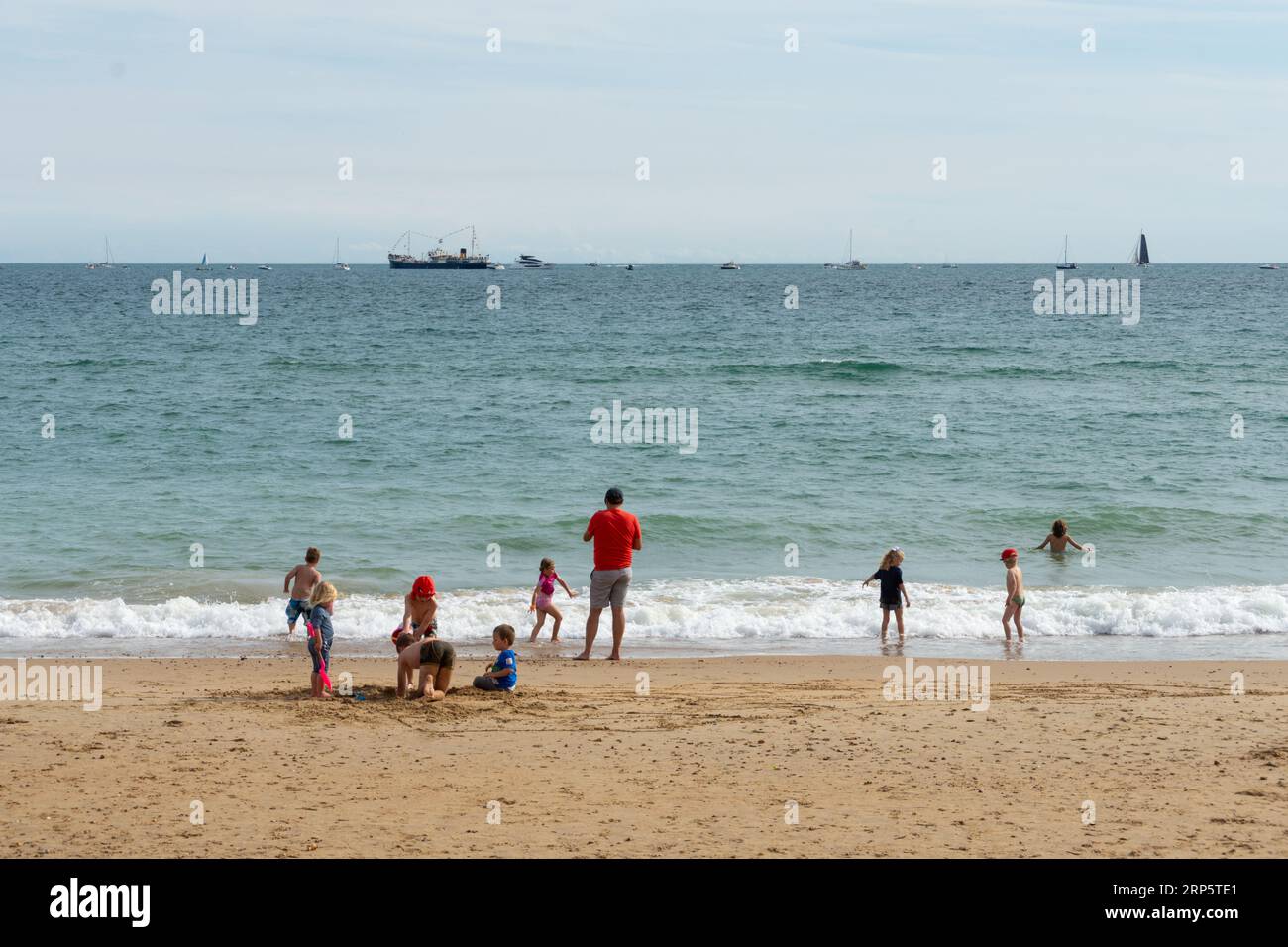 Bournemouth, UK - September 1st 2023: Family on the beach in front of ...