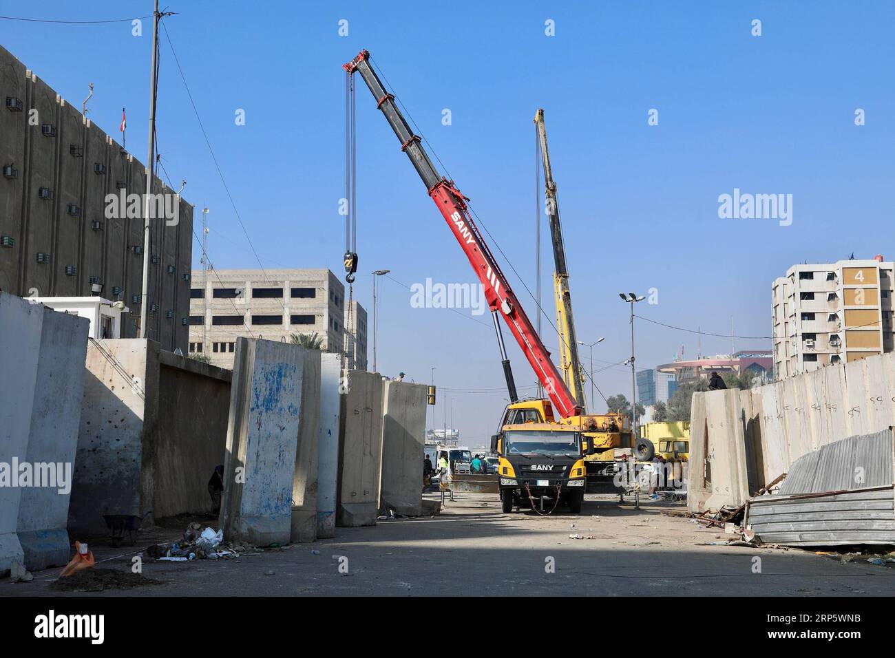 (181224) -- BAGHDAD, Dec. 24, 2018 -- Workers remove blocks surrounding ...