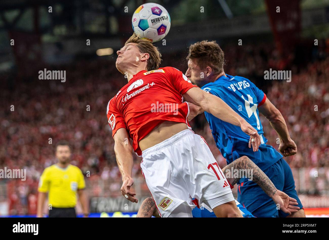 RB Leipzig's Willi Orban, right, dives for a header with Berlin's Kevin ...
