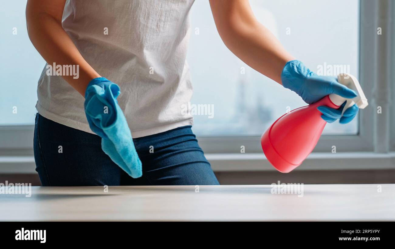 Home cleaning surface woman hands gloves wiper Stock Photo - Alamy