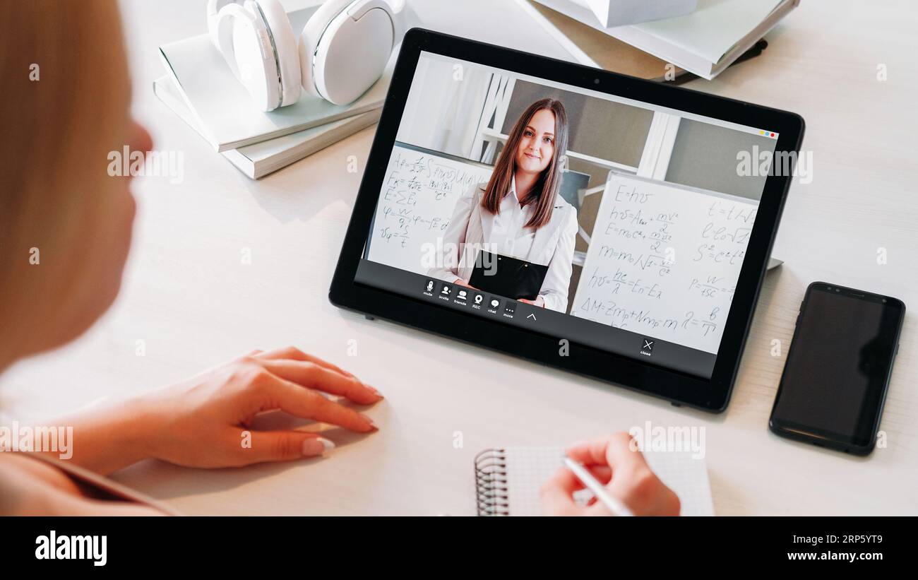 Online learning video lesson woman teacher tablet Stock Photo - Alamy
