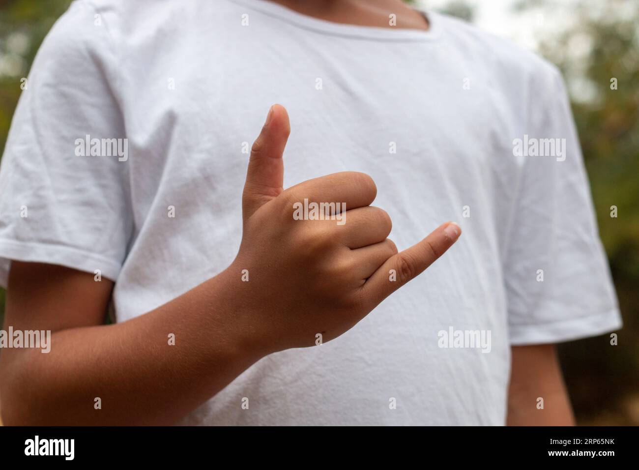 Child's hand making different shapes, either raising a finger, raising ...