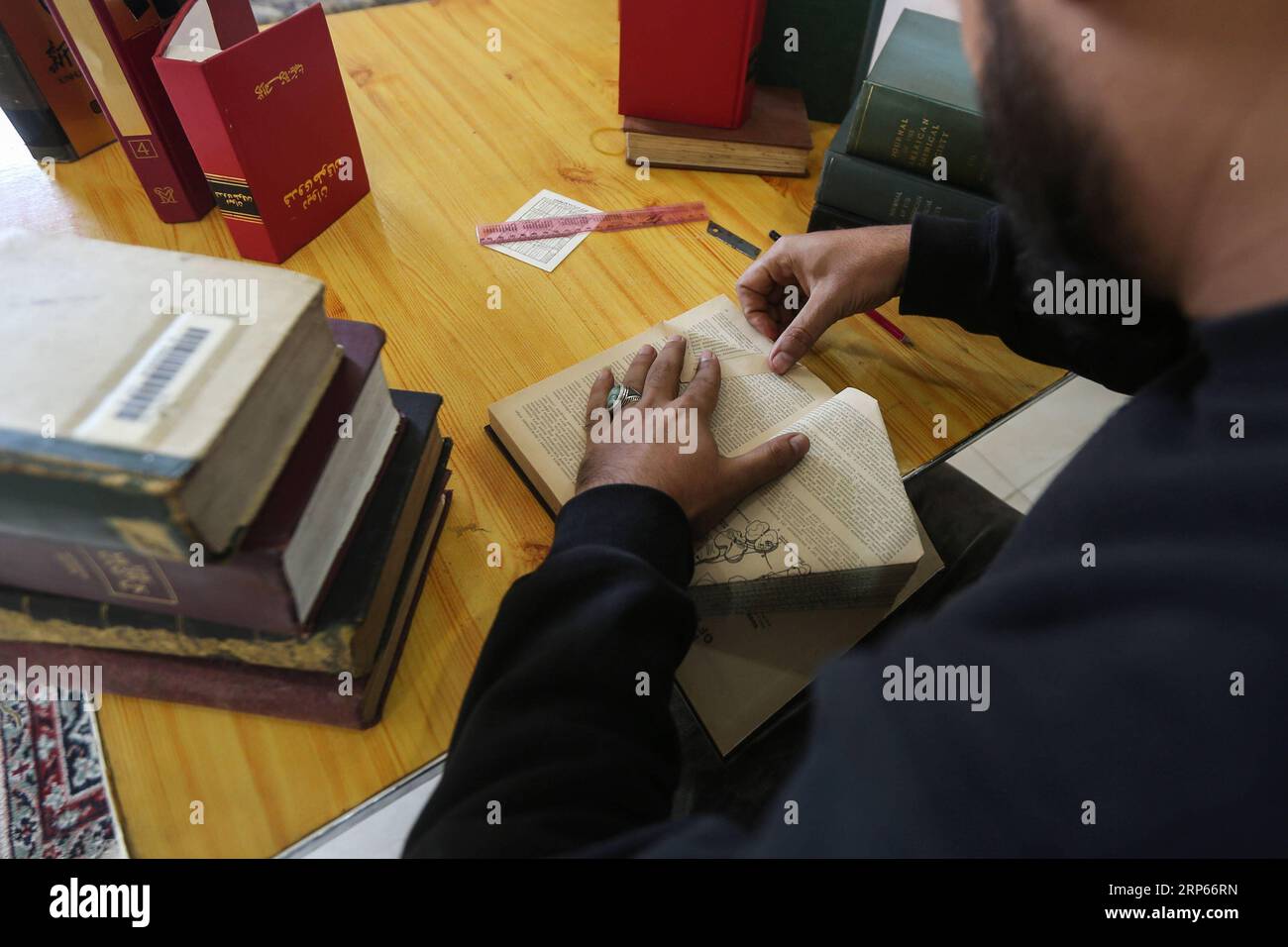 (190103) -- GAZA, Jan. 3, 2019 -- Ahmed Humaid, 28, folds paper sheets ...