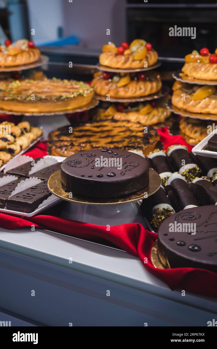 Varieties of homemade cakes on the counter in a pastry shop Stock Photo ...