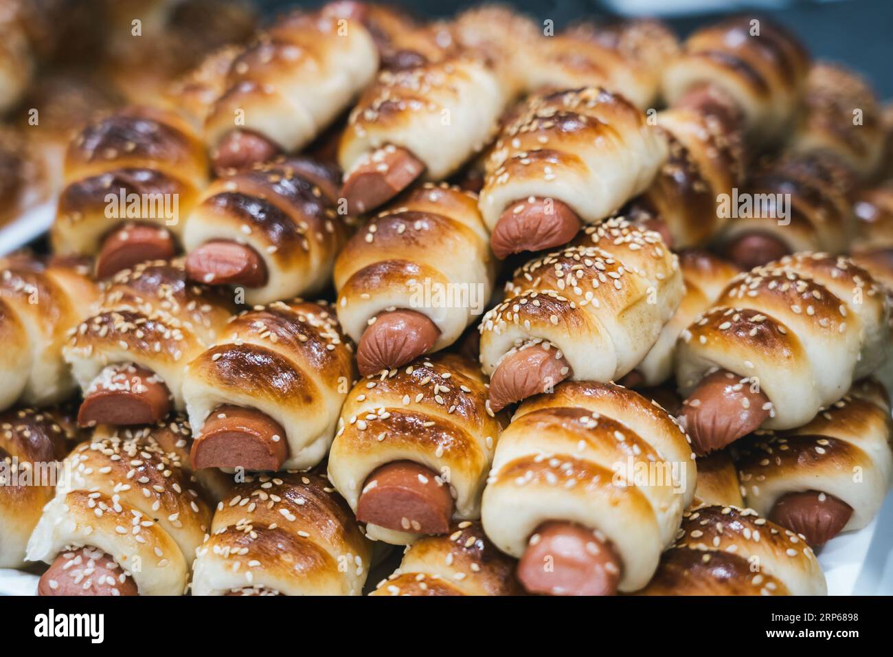 close-up of Freshly baked tasty sausage rolls, pigs in a blanket Stock ...