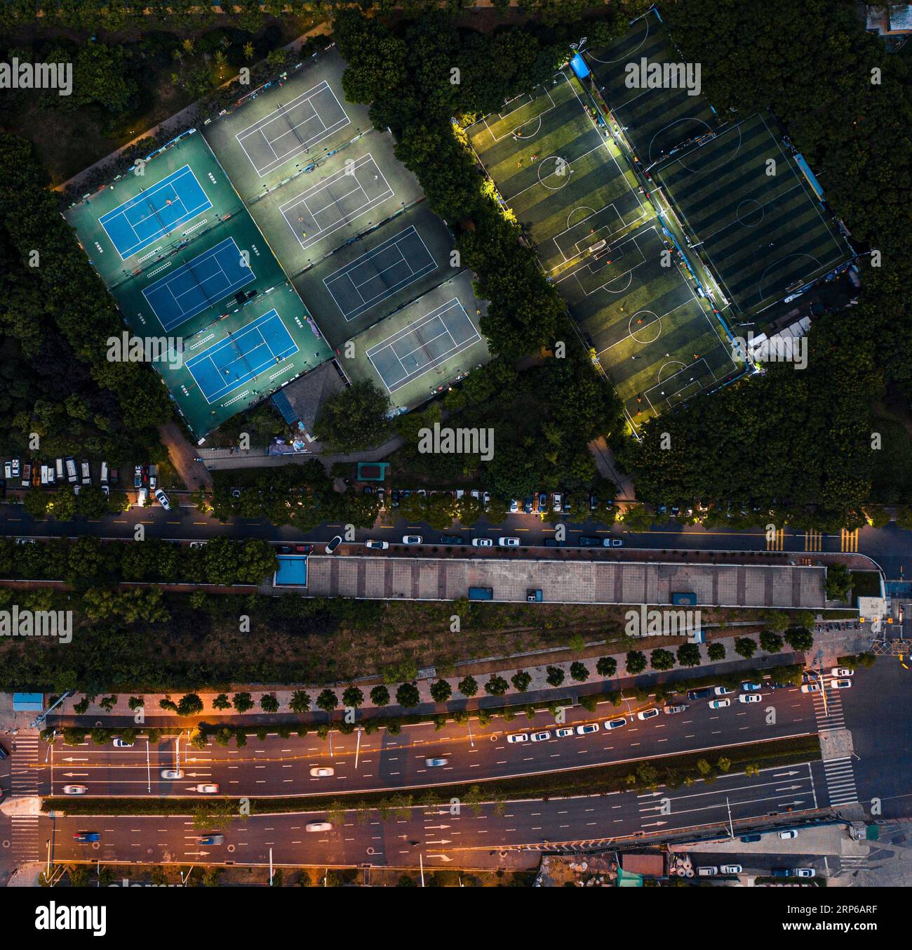 An aerial view of the night view of the sports field in the park forest ...