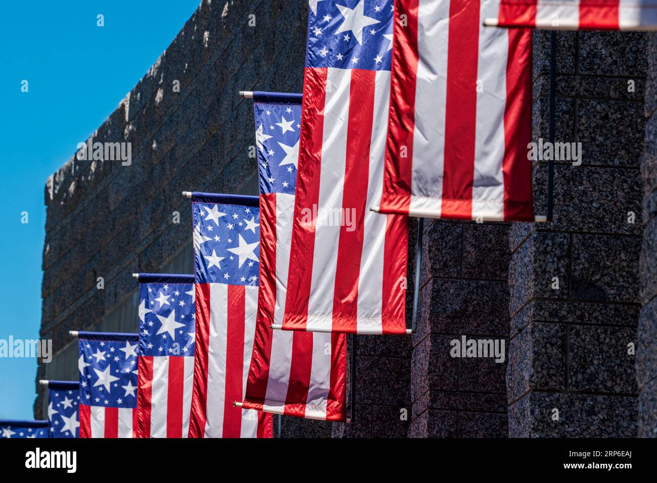 American Flags line entrance to Mount Rushmore National Memorial; Black ...