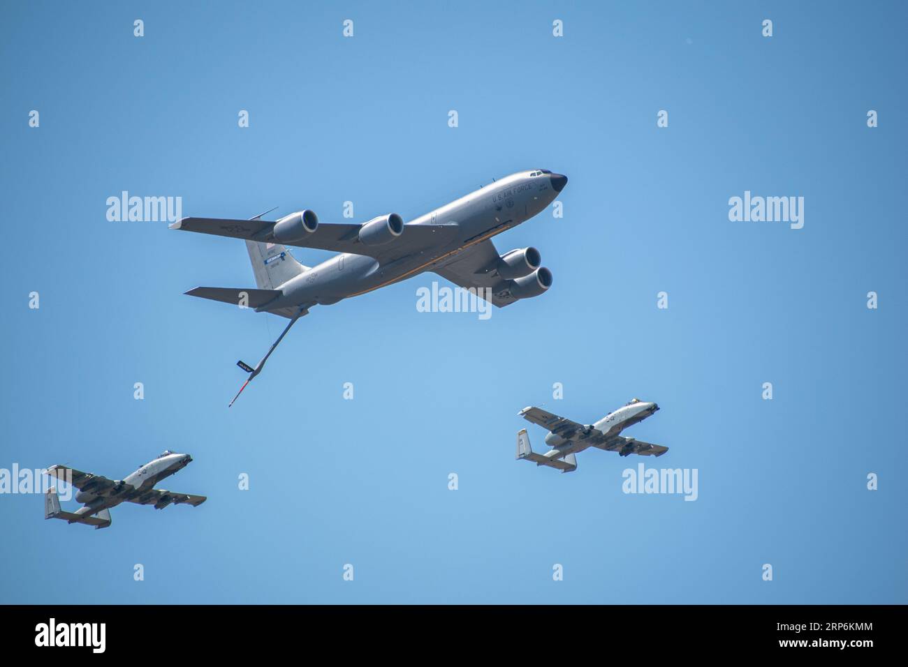 Three military planes flying in formation in the sky, with one of the ...
