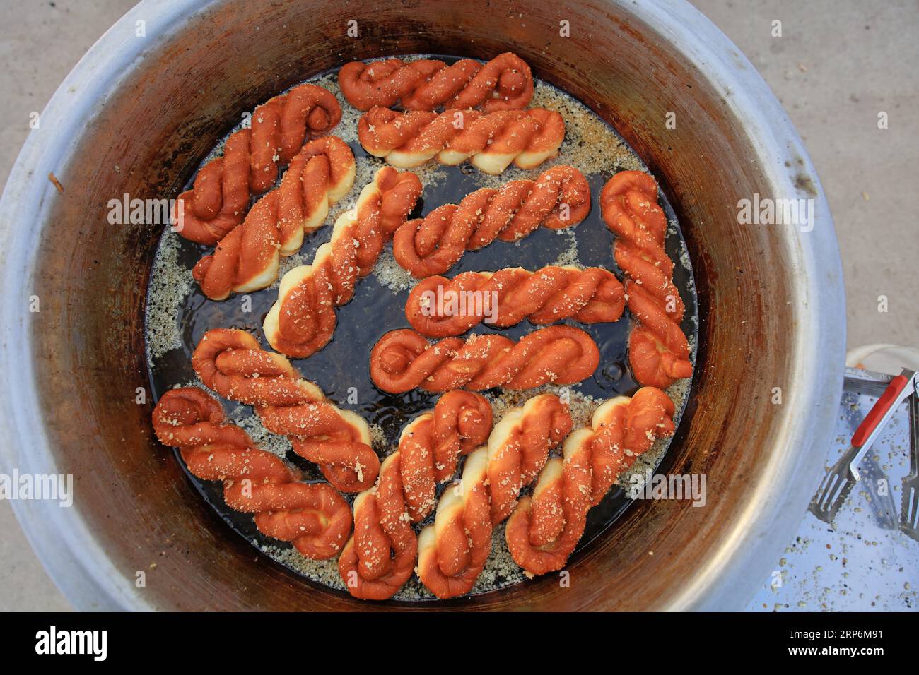 Mahua, a traditional Chinese food is fried in oil, North China Stock Photo - Alamy