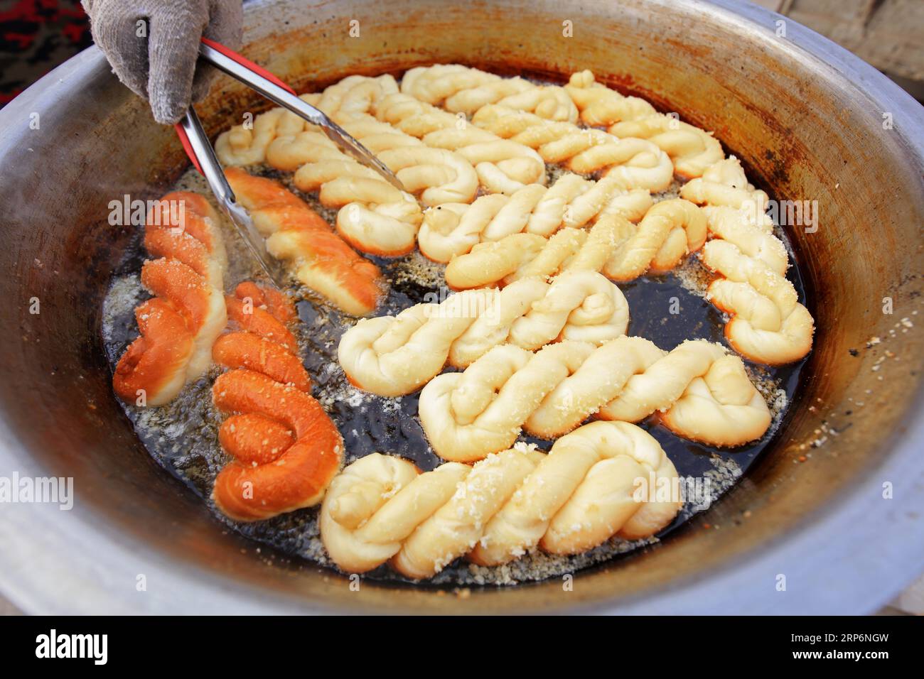 Mahua, a traditional Chinese food is fried in oil, North China Stock Photo - Alamy