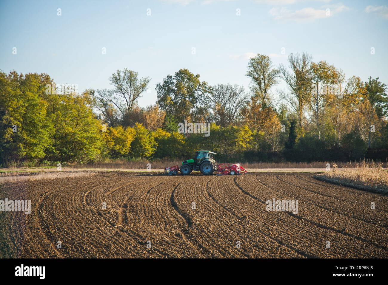 Tractor sows hi-res stock photography and images - Alamy