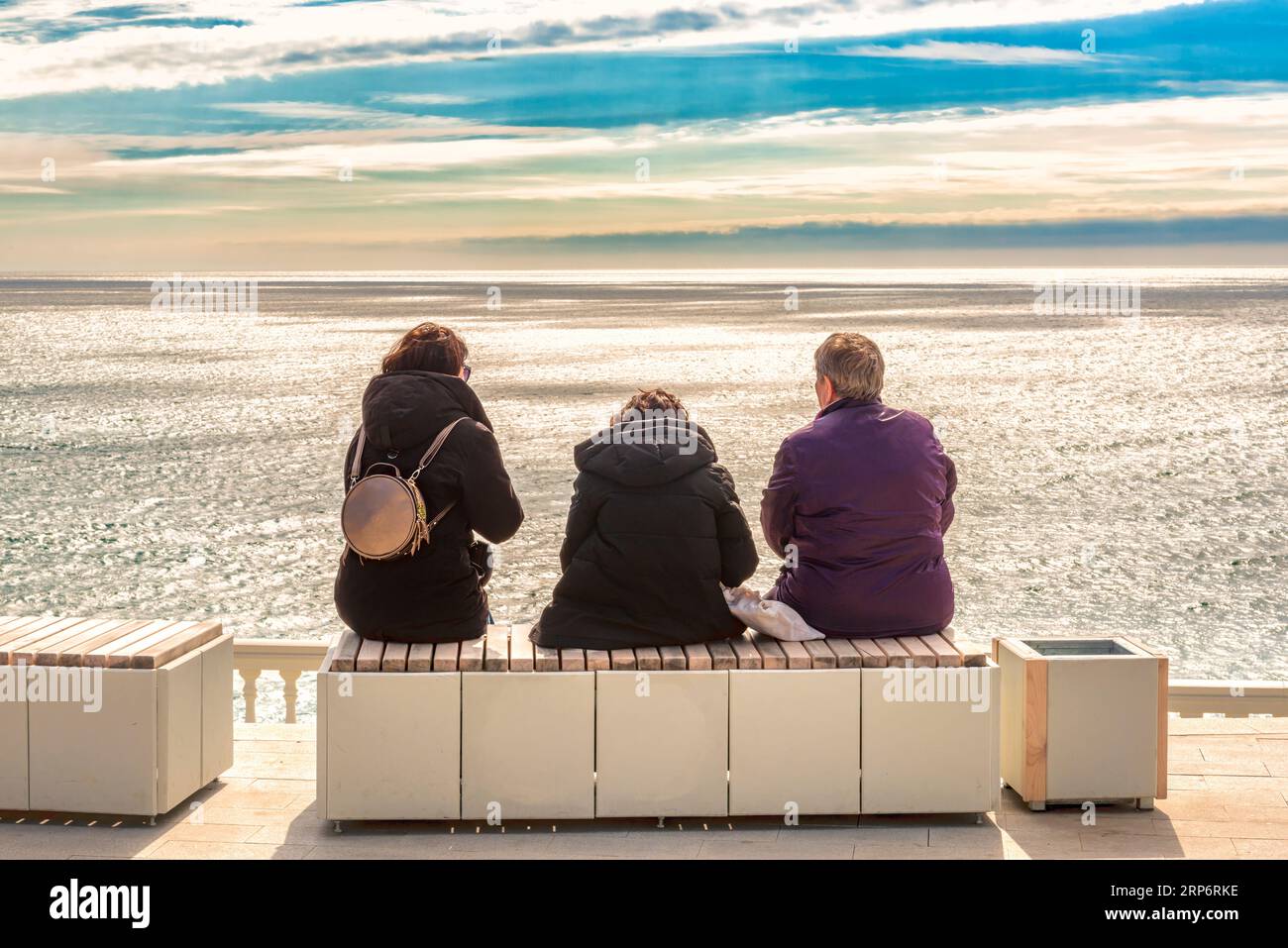 Women sit sea hi-res stock photography and images - Alamy