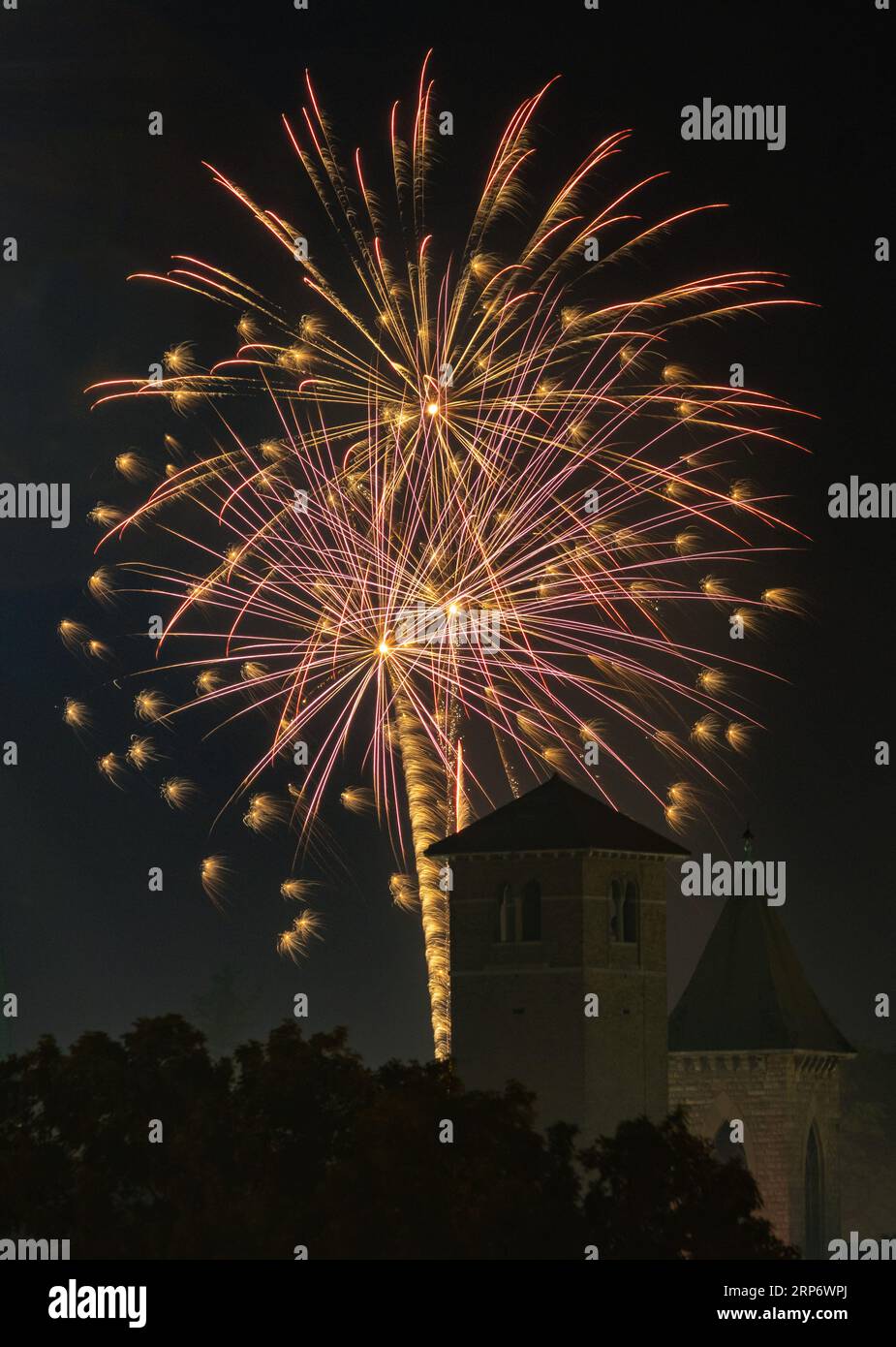 Fireworks explode over church steeples durng an Independence Day ...