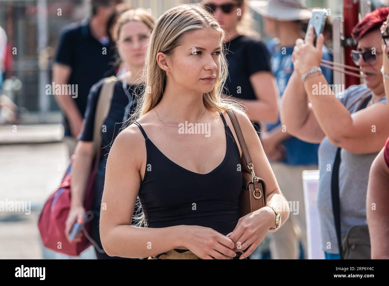 Beautiful girl walking through streets hi-res stock photography and images - Alamy