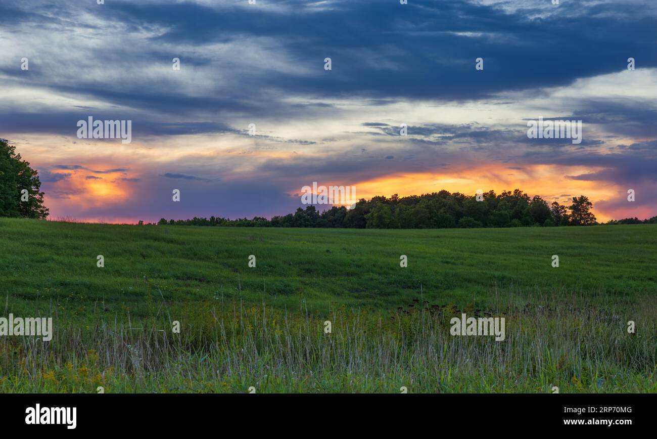 A pretty sunset over a hayfield in northern Wisconsin Stock Photo - Alamy