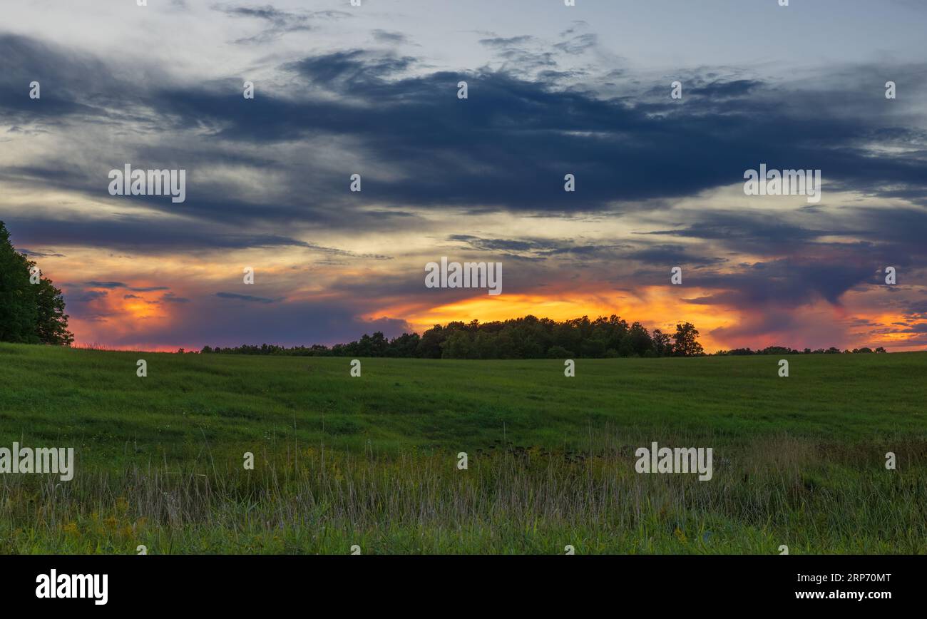 A pretty sunset over a hayfield in northern Wisconsin Stock Photo - Alamy