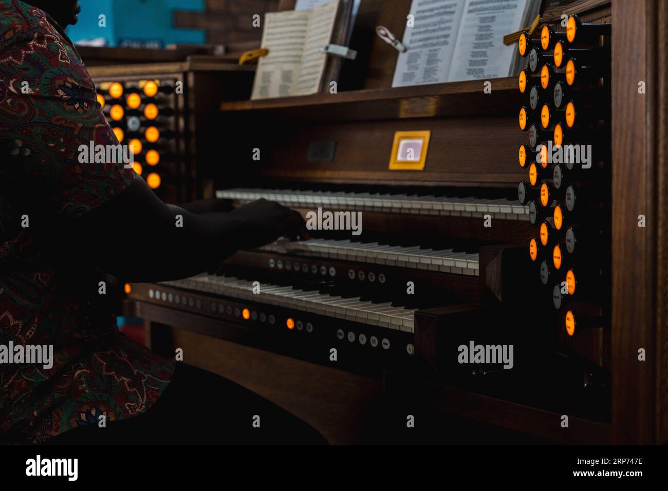 Black man playing organ Stock Photo - Alamy