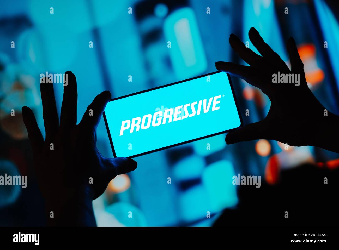 In this photo illustration, the Progressive Corporation logo is ...
